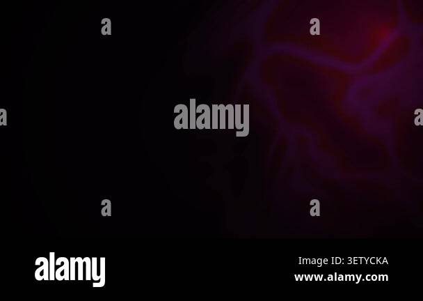 A bright red light glowing in a dark mysterious space with purple hues ...