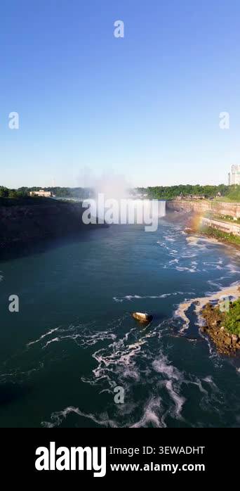 Rainbow forming over the Niagara River below Horseshoe Falls in Ontario ...