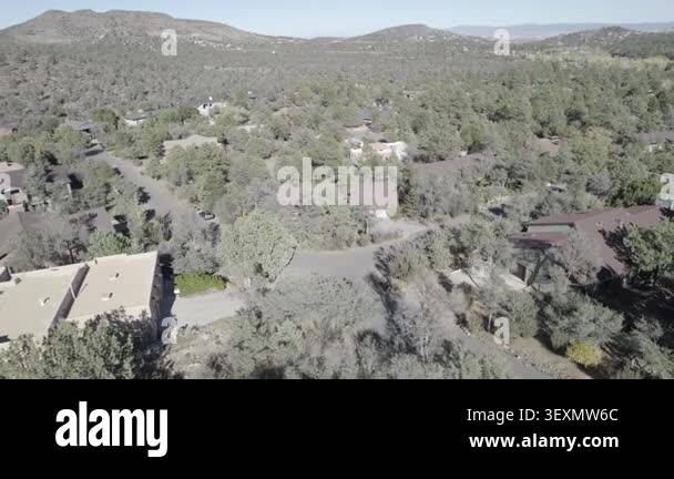 An elevated perspective reveals a calm suburban hillside community with ...