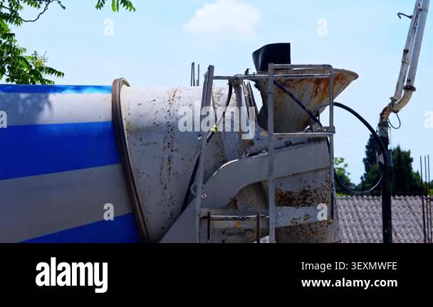 Industrial concrete mixer truck working at a construction site with ...