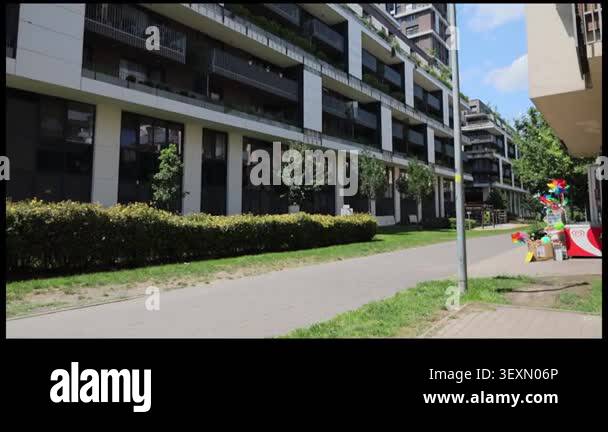 Wide shot of modern luxury apartment buildings in a quiet residential ...