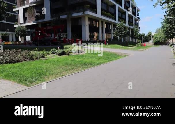 Wide shot of modern luxury apartment buildings in a quiet residential ...