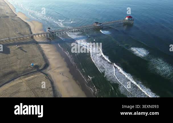 Huntington Beach Pier stretches into Pacific, creating rhythmic shadow ...