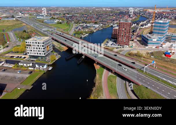 A high-angle aerial drone photograph showing an urban Dutch landscape ...