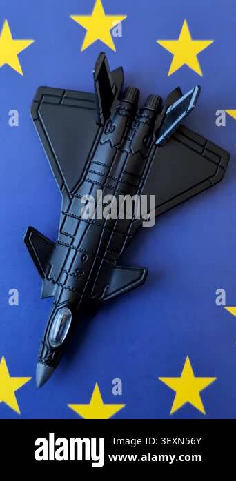 A fighter jet on the European Union flag as a conceptual backdrop ...