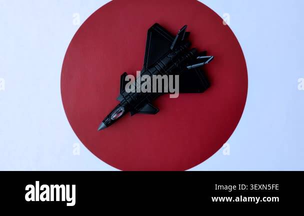 A fighter jet against the Japanese flag as a conceptual background ...
