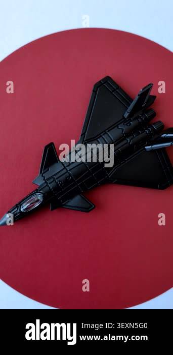 A fighter jet against the Japanese flag as a conceptual background ...