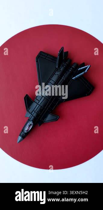 A fighter jet against the Japanese flag as a conceptual background ...