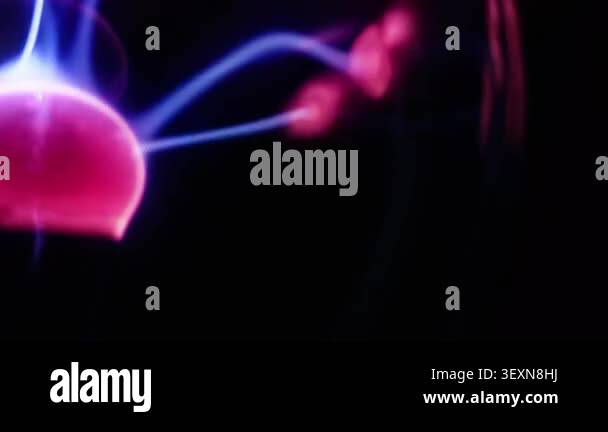 Close up of a human hand touching a glowing plasma sphere as bright ...