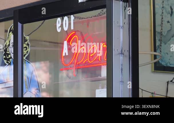 Glowing red open neon sign on vintage diner glass window Stock Video ...