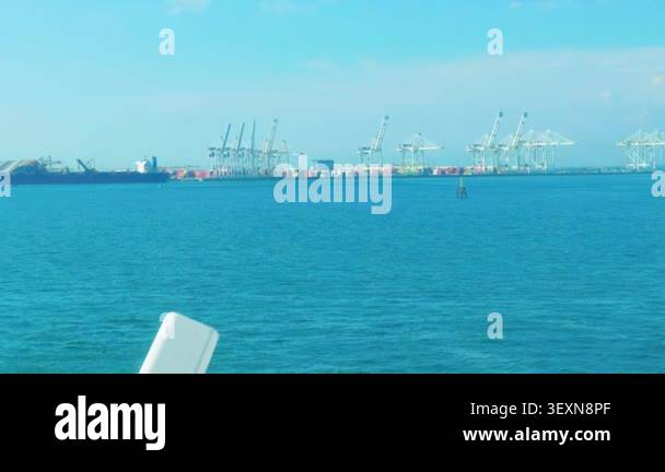 Industrial marine container terminal and bulk cargo ship at port Stock ...