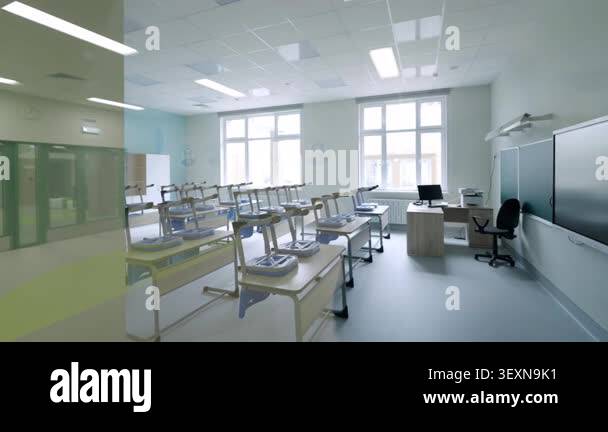 Classroom features neat rows of student desks and interactive ...