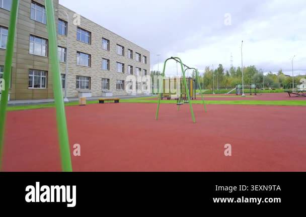 Spacious outdoor recreation zone features various equipment for kids ...