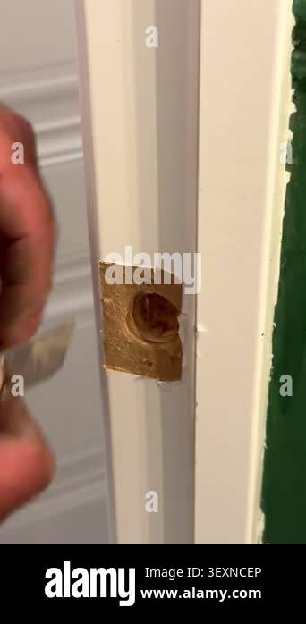 Men's hands repairing a door, door lock Apartment renovation, worker ...
