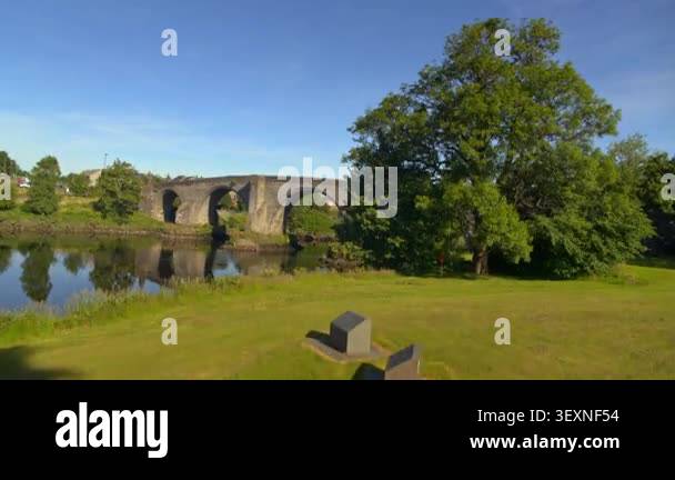 Aerial rising shot revealing the historic medieval Stirling Old Bridge ...