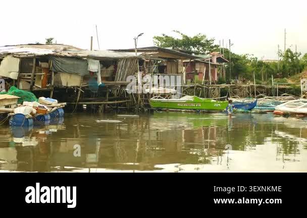 Informal settlers slums community urban poor squatters stilt houses ...