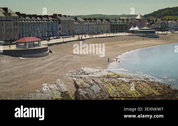Aerial view of the Aberystwyth seafront promenade, beach, and historic ...