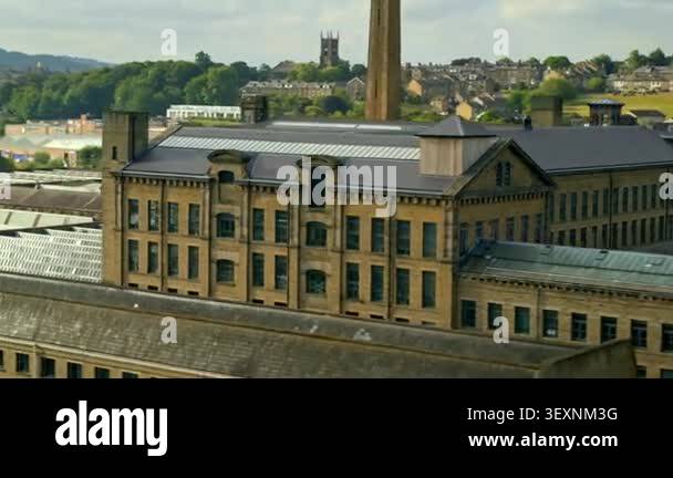 Aerial view of a large historic industrial building in a small English ...