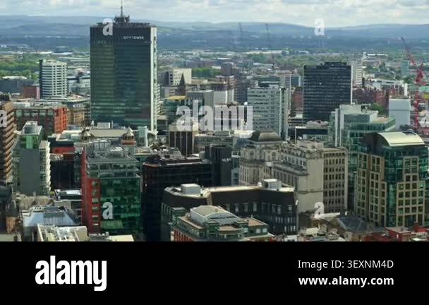 Sunny day aerial view of Manchester city centre with the City Tower and ...