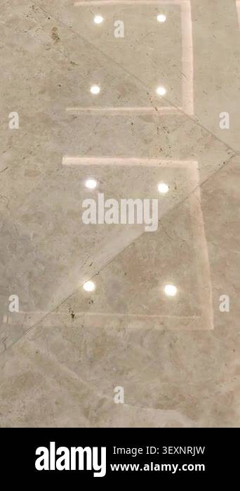 Glossy marble floor tile reflection in mall interior. Cinematic of ...