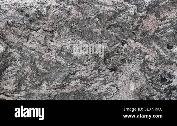Close-up of natural granite rock surface with swirling patterns Stock ...