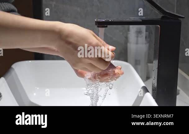 Woman Washing Hands with Running Water at Modern Bathroom Sink Stock ...
