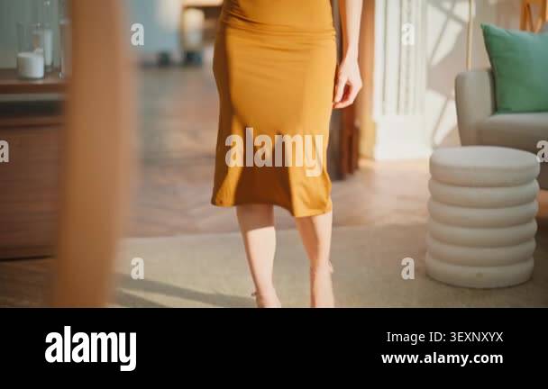 Attractive lady admiring fitted dress reflection in home bedroom ...