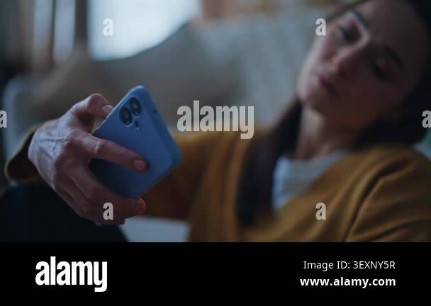 Upset lady watching smartphone reading bad new sitting evening ...