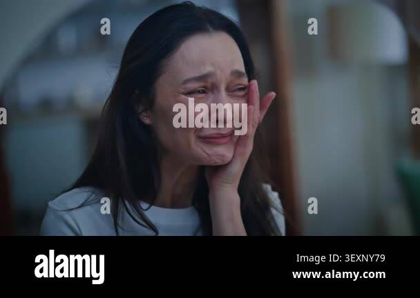 Young woman crying bitterly looking reflection mirror at emotional ...
