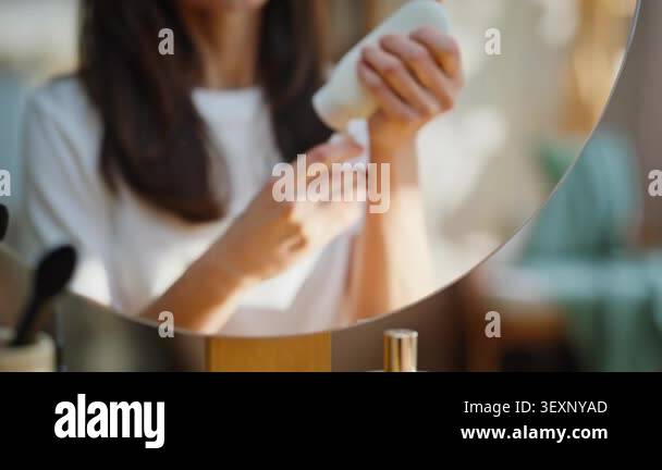 Brunette taking luxury cream looking home mirror closeup. Relaxed woman ...