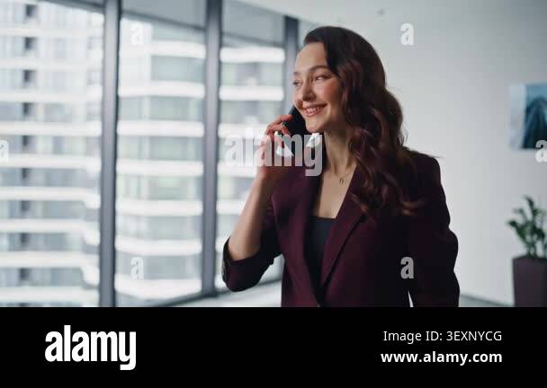 Company manager making call on go at panorama windows hall closeup ...