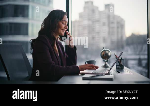 Positive consultant talking mobile phone in modern office closeup ...