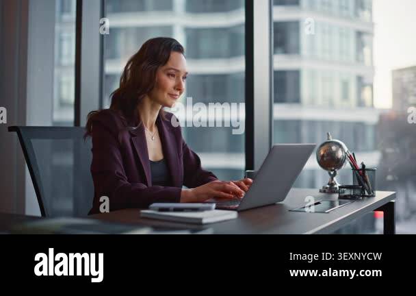 Woman manager corresponding with client using laptop sitting luxury ...