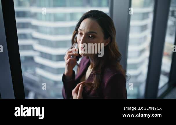 Wealthy business lady calling mobile phone standing office panoramic ...