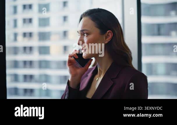 Worried professional speaking cellphone at luxury office space closeup ...