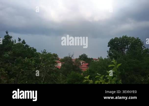 Video footage of a thunderstorm with lightning strikes over a ...