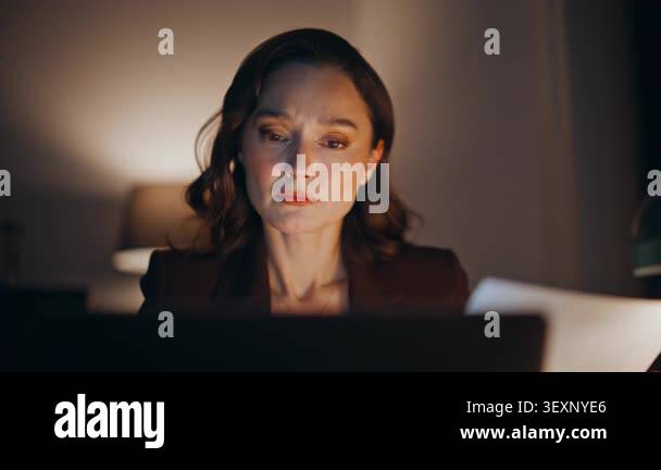 Overloaded employee reviewing documents at night workplace closeup ...