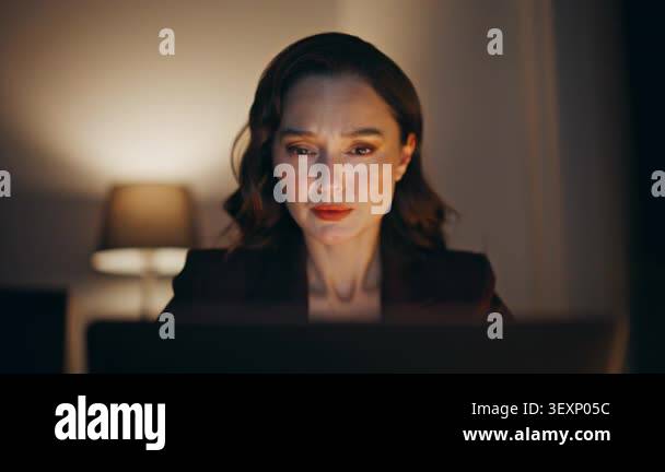 Stressed employee reading mail worried bank loan notification at night ...