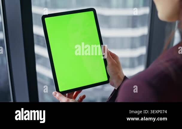 Employee holding greenscreen tablet at company workplace closeup ...