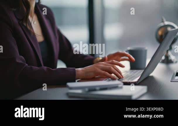 Closeup woman typing keyboard laptop at office. Businesswoman focusing ...
