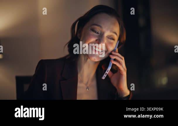 Writing entrepreneur calling cellphone at night office space closeup ...