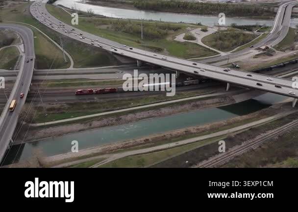 Experience a stunning 4K aerial drone view of a long freight train ...