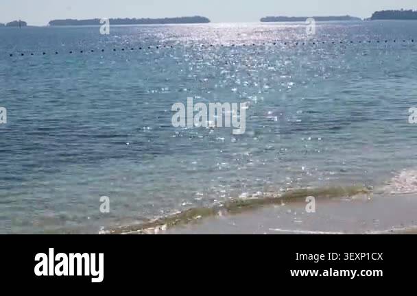 4k Footage of Sparkling tropical sea water with distant islands in ...