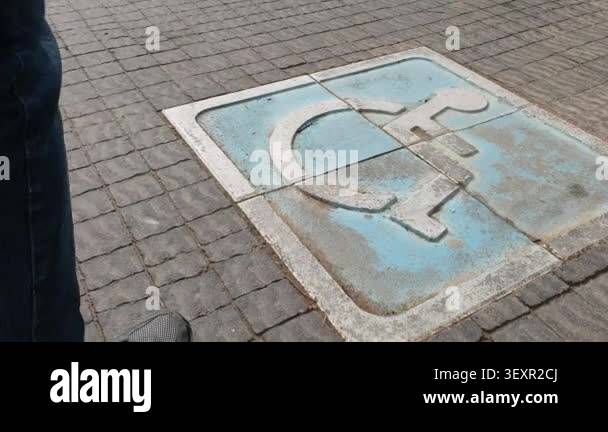 Disabled with crutches and plaster in parking Stock Video Footage - Alamy