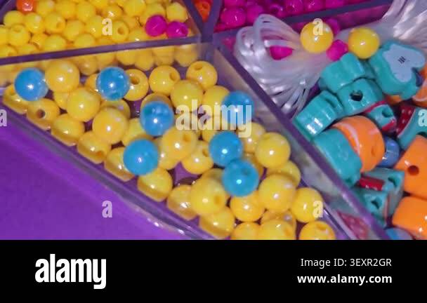 Brightly colored sets of beads, seed beads, and decorative elements in ...