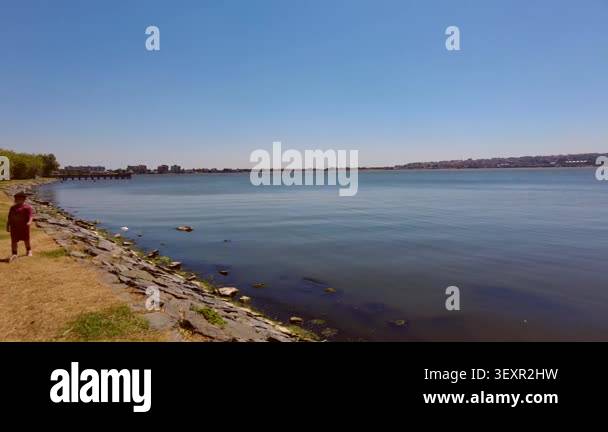 Istanbul,Turkiye.June 24,2026.Kucukcekmece Lake shoreline with walking ...
