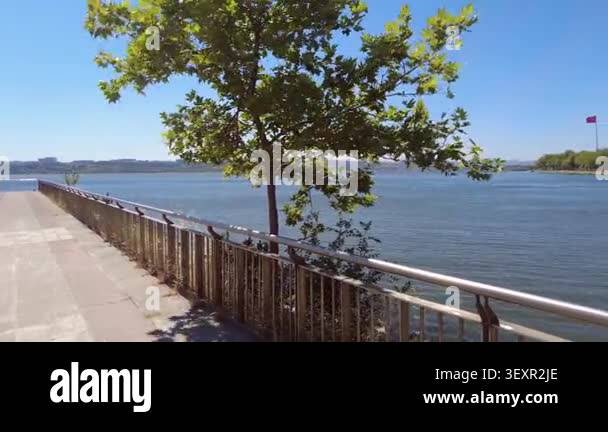 Istanbul,Turkiye.June 24,2026.Kucukcekmece Lake shoreline with walking ...