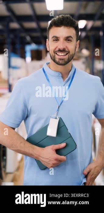 Portrait of a happy male worker holding a digital tablet. The logistic ...