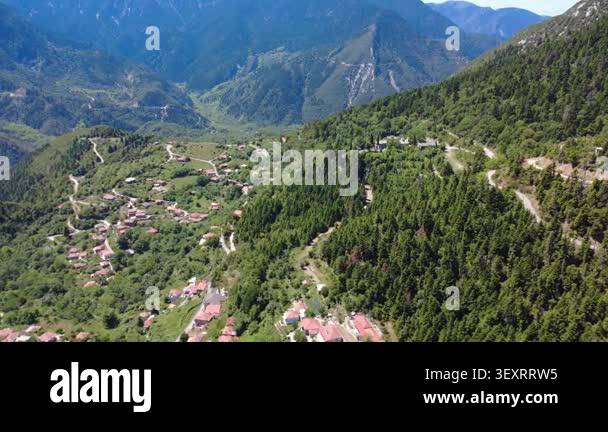 Aerial wide angle view of a small isolated village at the edge of a ...