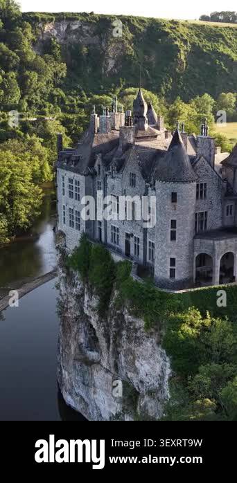 Walzin Castle in the Belgium Ardennes sits on a rocky cliff. A river ...